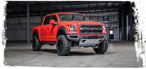 Red Ford Raptor Lifted
